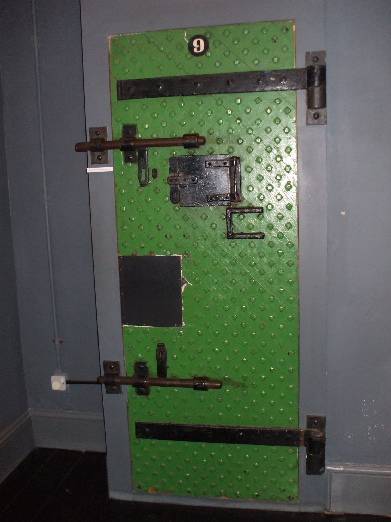 Door of a prison cell, now in Jersey Museum. Copyright Gilly Carr ...